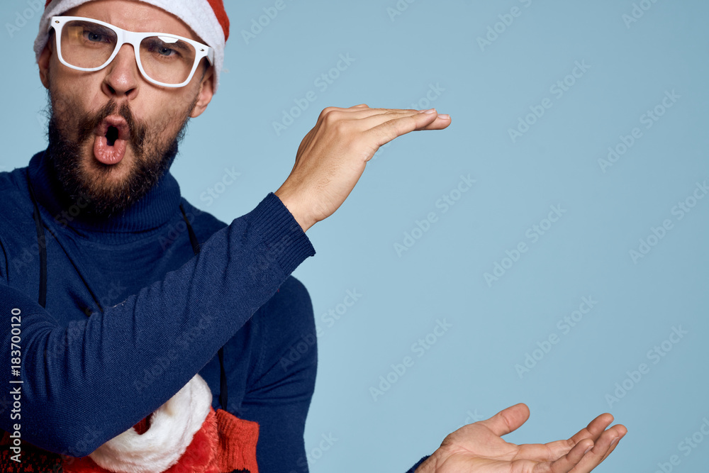 man shows his hands size, portrait, emotions, new year, light blue ...