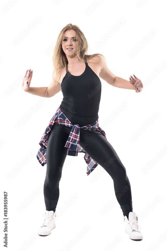 Modern aerobics woman instructor dancing jazz dance smiling and looking ...