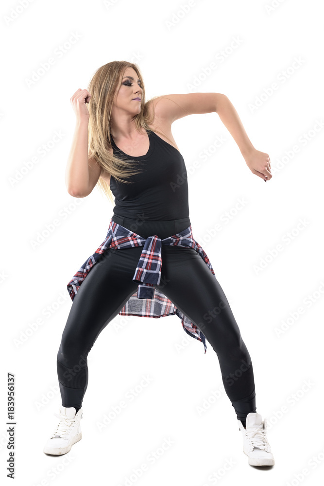 Energetic dance hall female dancer moving arms and hips in motion. Full ...