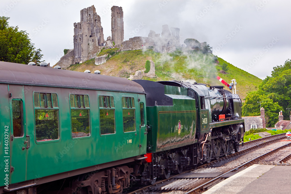 Corfe castle and steam engine, Dorset, England, UK Stock Photo | Adobe ...