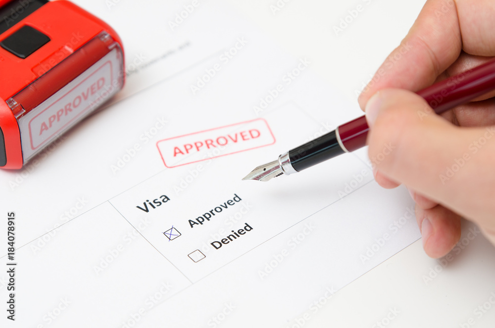 Visa and approved stamp on a document form Stock Photo | Adobe Stock
