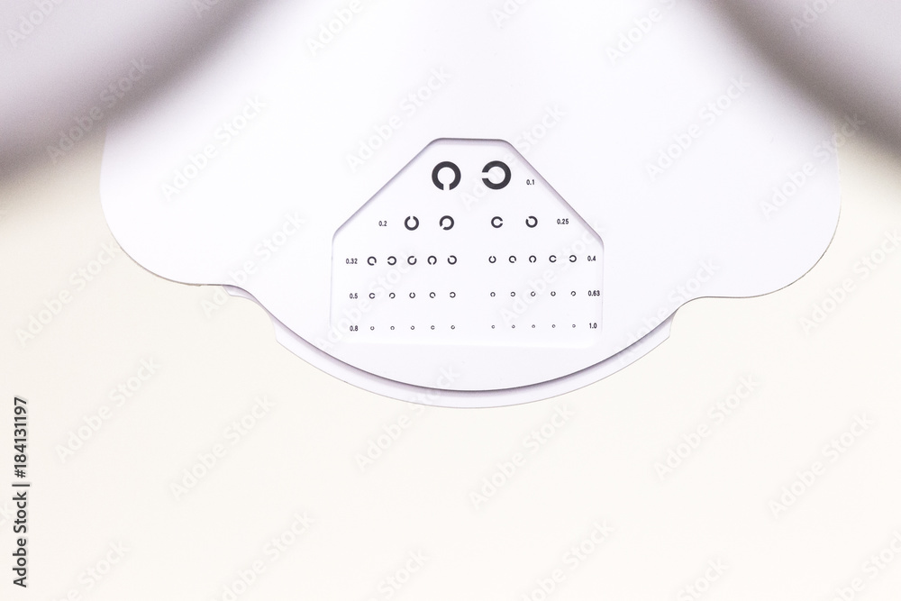 the cabinet of the eye doctor. eye sight test called landolt C. with ...
