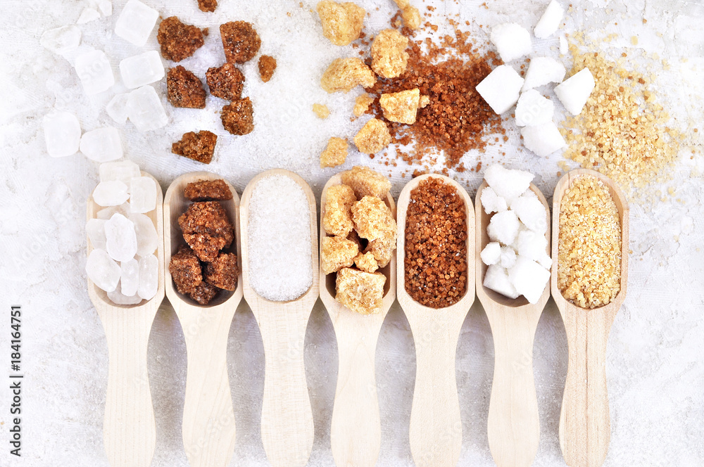 Mix of sugar varieties: unbleached, brown and white, refined and ...