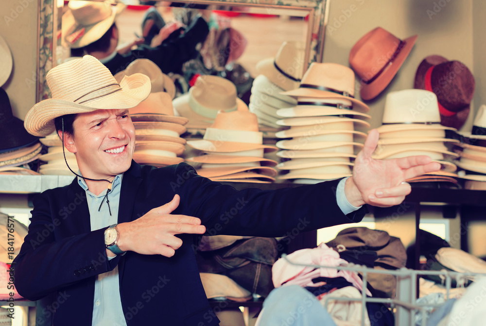 adult male try on western hat at the shopping center Stock Photo ...