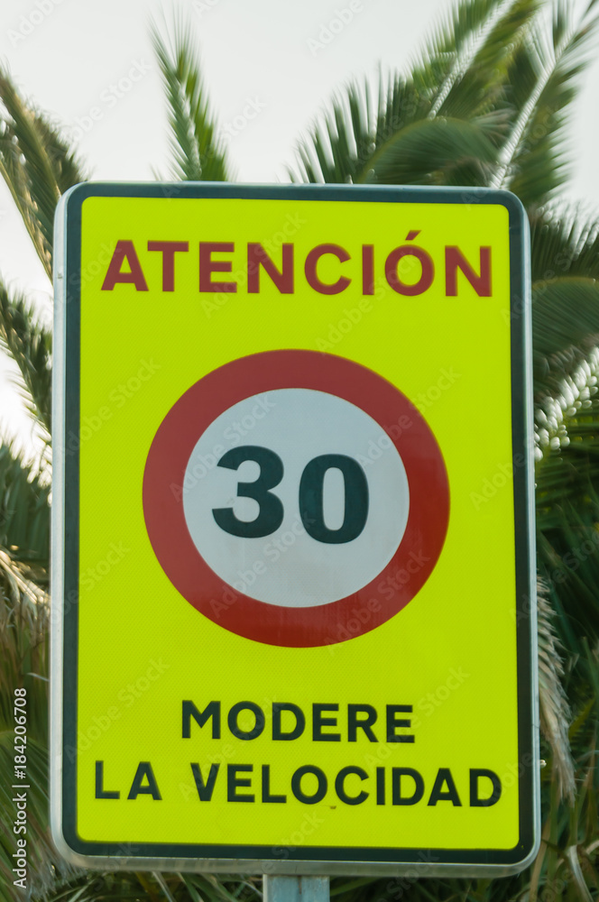 Spanish road traffic sign warning drivers to reduce their speed to ...