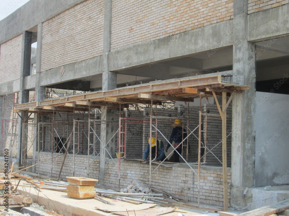 Bricklayer calcium silicate bricks block and stacked it together using ...