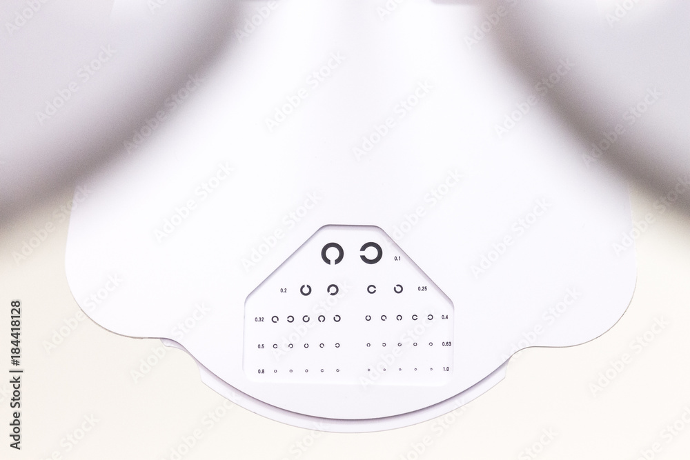 the cabinet of the eye doctor. eye sight test called landolt C. with ...