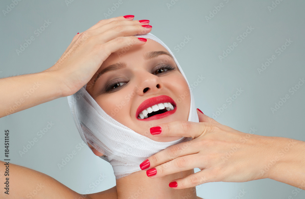 Beauty and Fashion. Woman after plastic surgery with bandaged face ...