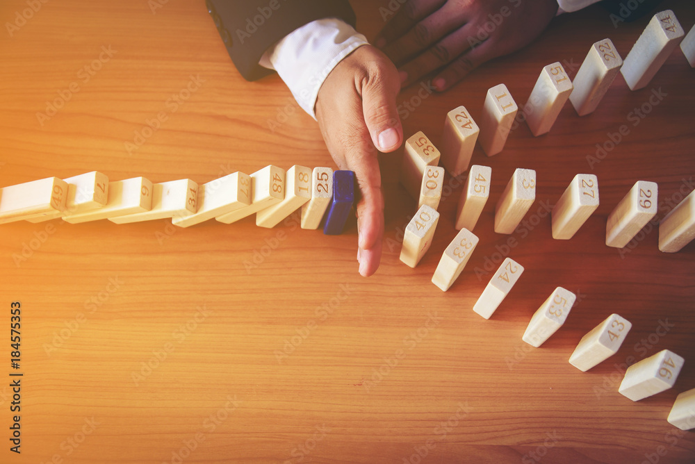 man hand pick one from many wooden blocks.business concept of choosing ...