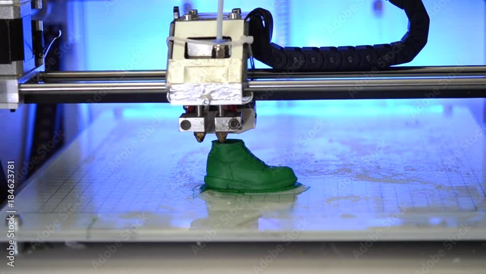 3d printing printer bright green model close-up. Automatic 3D printer ...