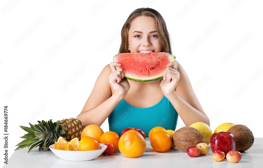 Portrait of a Woman Eating Fruits Stock Photo | Adobe Stock