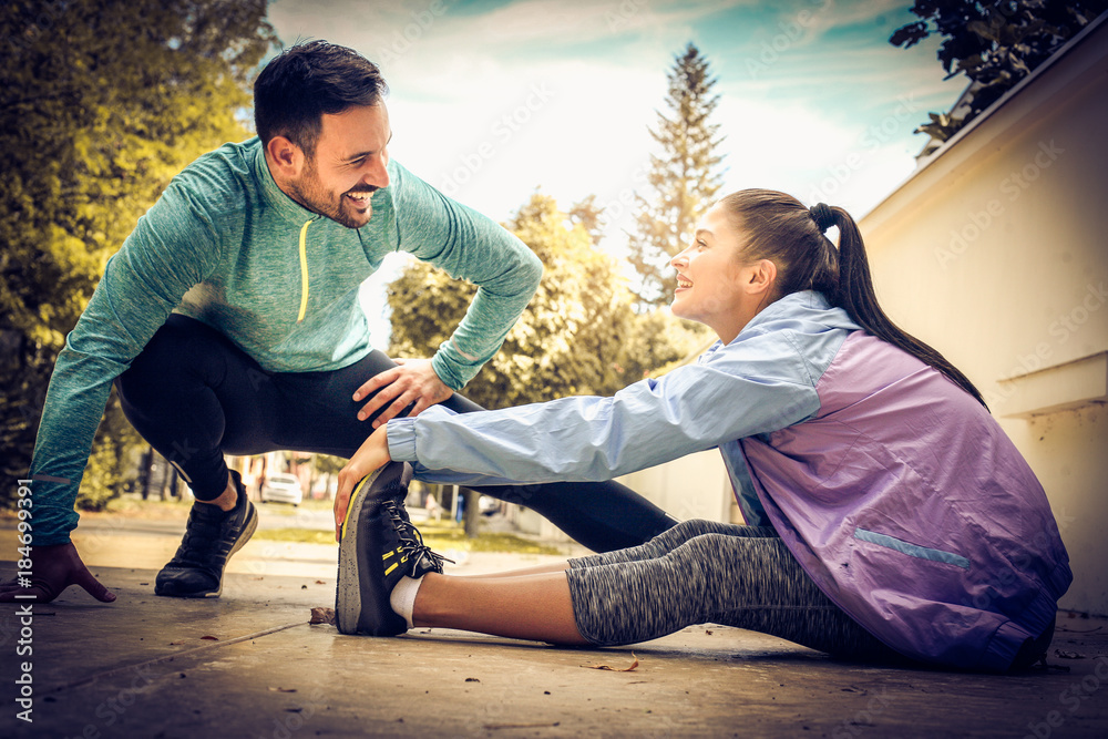 Two people exercising together. Stretching before exercise. Stock Photo ...