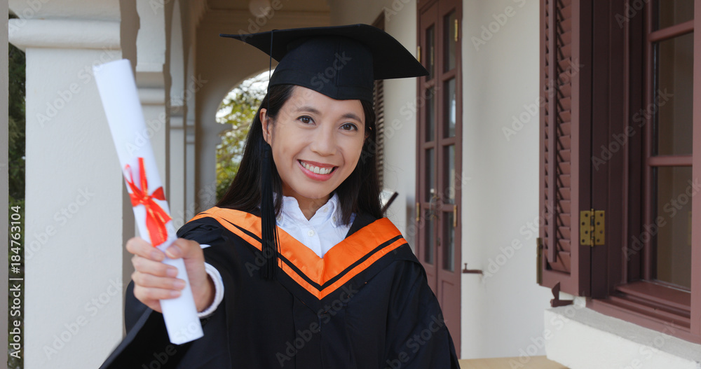 Thrill woman get graduation in university Stock Photo | Adobe Stock