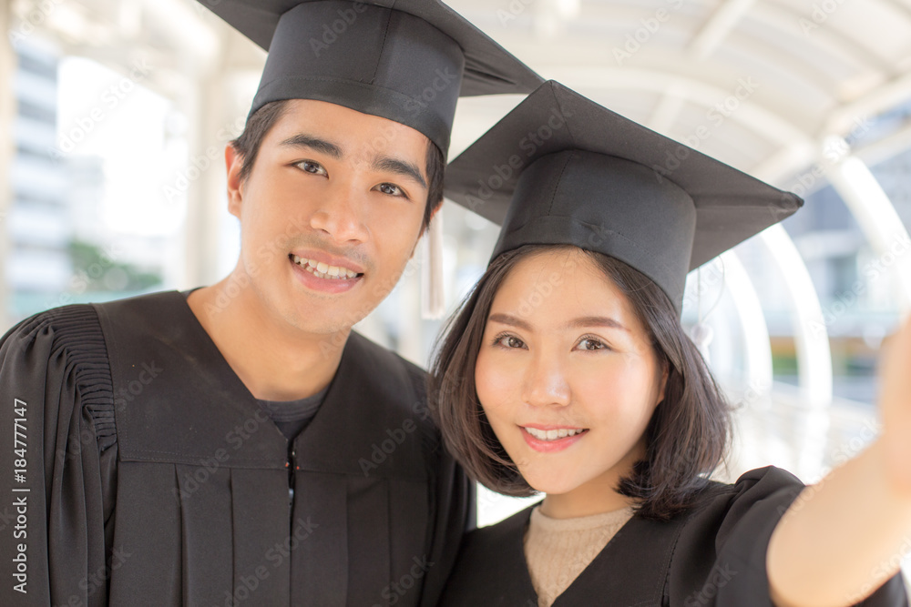 Young Asian People Students wearing Graduation hat and gown, city ...