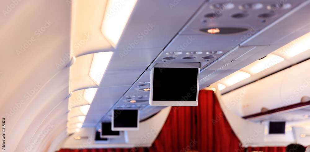 Airplane's tv screens in a row. Copyspace and blank, black screen ...