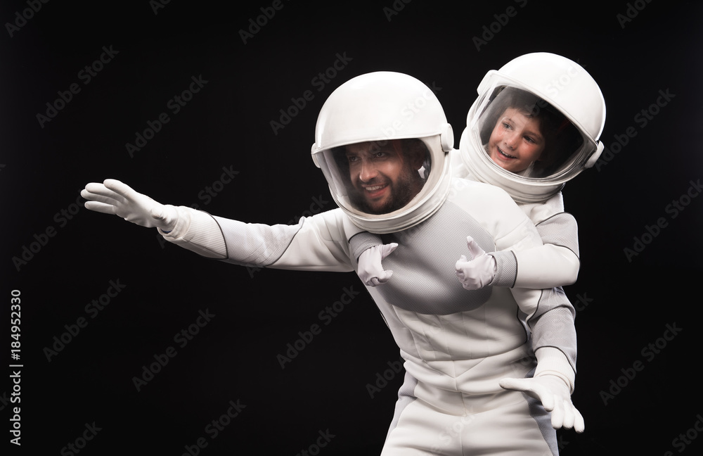 Always fun. Cheerful father and little son wearing hyperbaric astronaut ... Always fun. Cheerful father and little son wearing hyperbaric astronaut ...