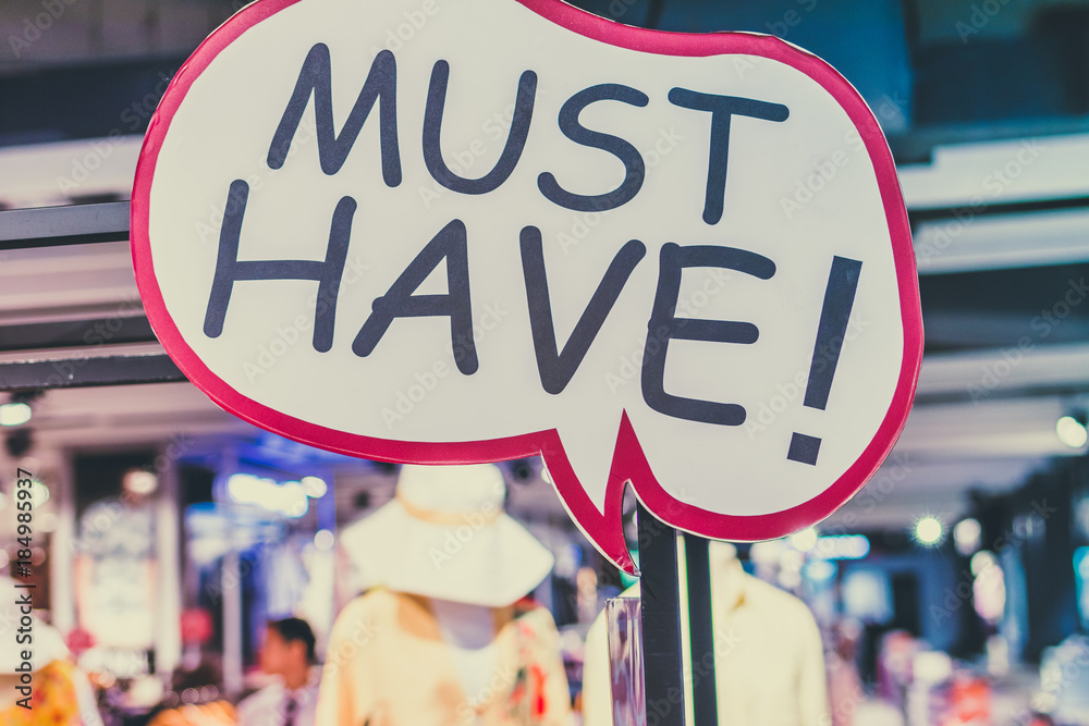 Must Have placard in the shopping mall. Fashion store sign. Bali island ...