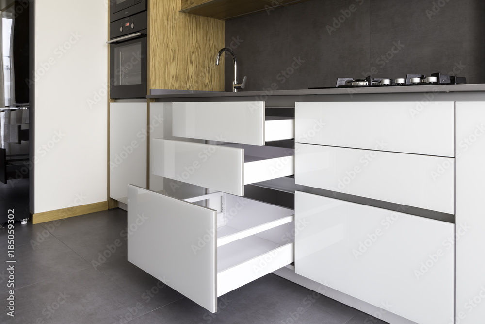 Opened kitchen drawer, kitchen in a modern loft style with wooden ...