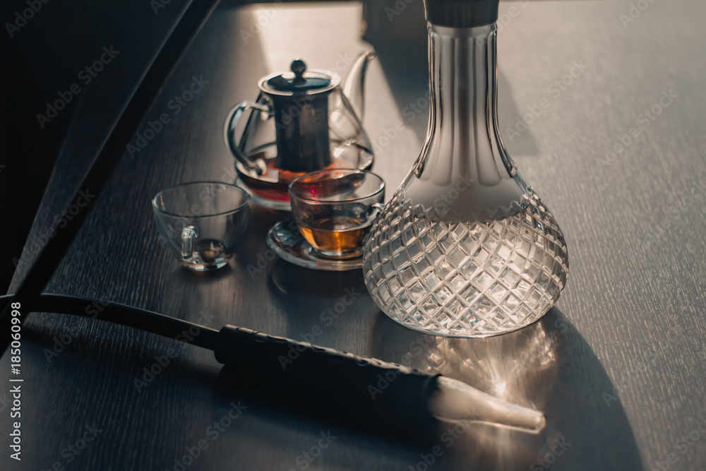 Stylish hookah glass and tea kettle Stock Photo | Adobe Stock