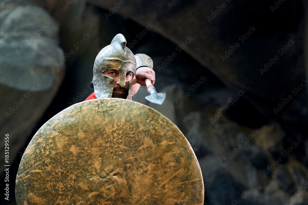 Cropped shot of a Spartan warrior in battledress standing in fighting ...