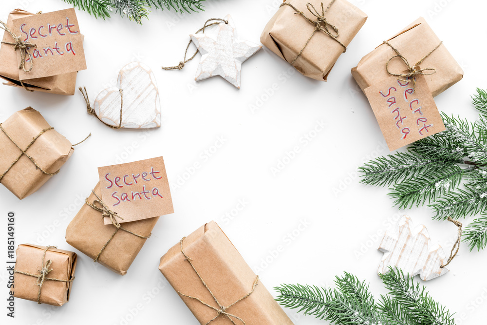 Secret Santa christmas game. Wrapped gift boxes with handwritten notes ...