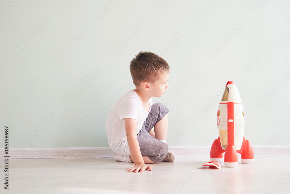 Active little boy playing the rocket toys, Child showing rocket toy ...