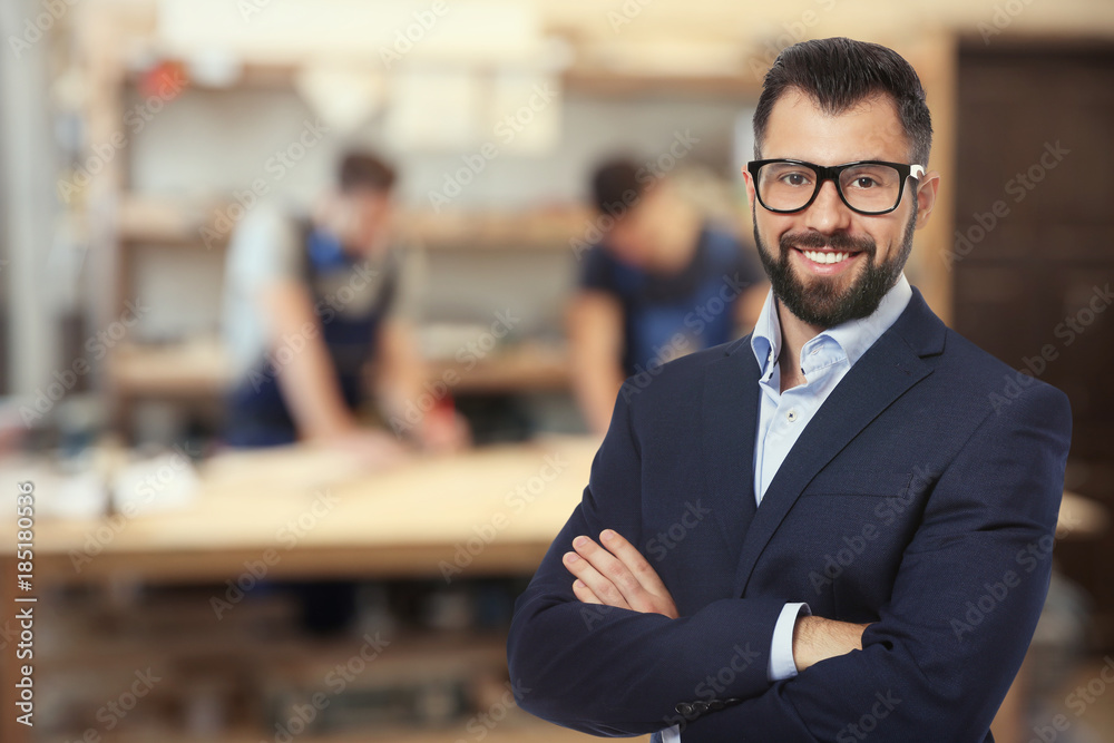 Owner of business and staff in carpentry workshop Stock Photo | Adobe Stock