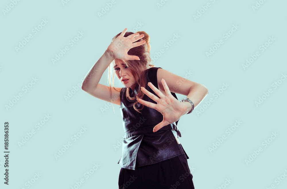 Stockfoto scared woman raising hands up in defense afraid about to be ...