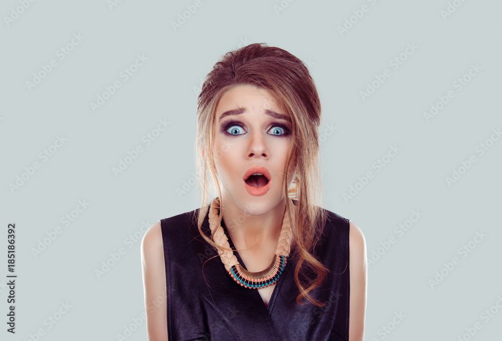 Portrait frightened shocked scared woman looking at camera isolated on ...