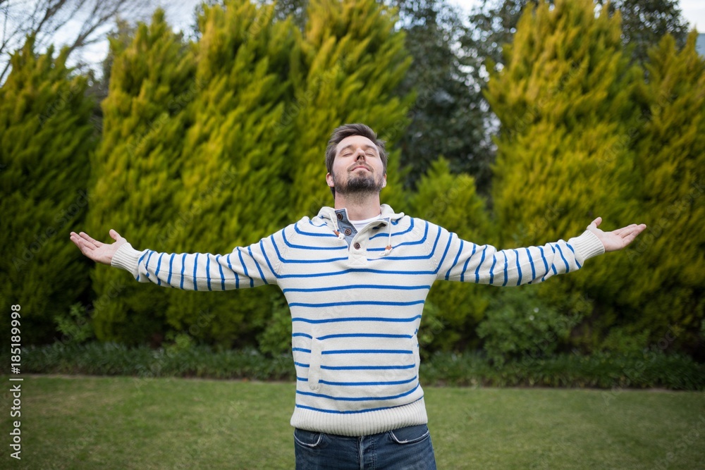 Man standing with arms wide open Stock Photo | Adobe Stock