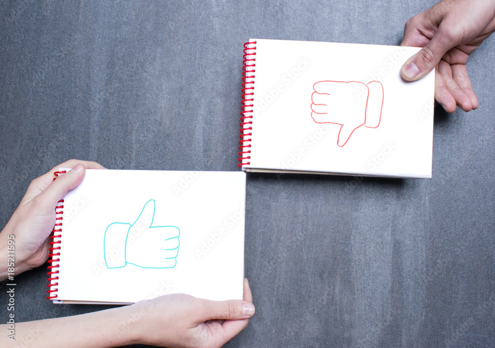 Man`s and woman`s hands showing like and dislike signs. Stock Photo ...