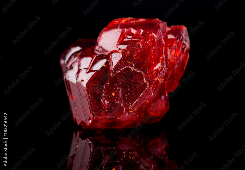 Red natural crystal mineral on a black background Stock Photo | Adobe Stock
