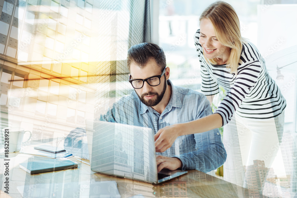 Let me help you. Stylish young nice-looking colleagues working in the ...