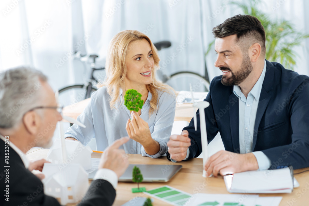 Lovely trees. Creative enthusiastic young engineer feeling glad while ...