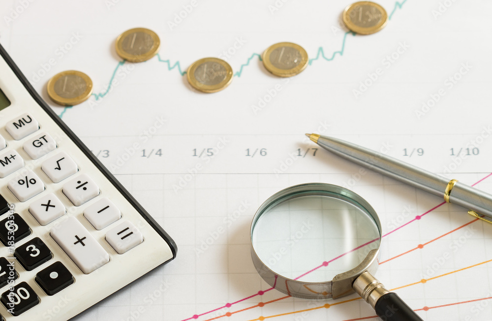finance background with calculator and magnifier Stock Photo | Adobe Stock