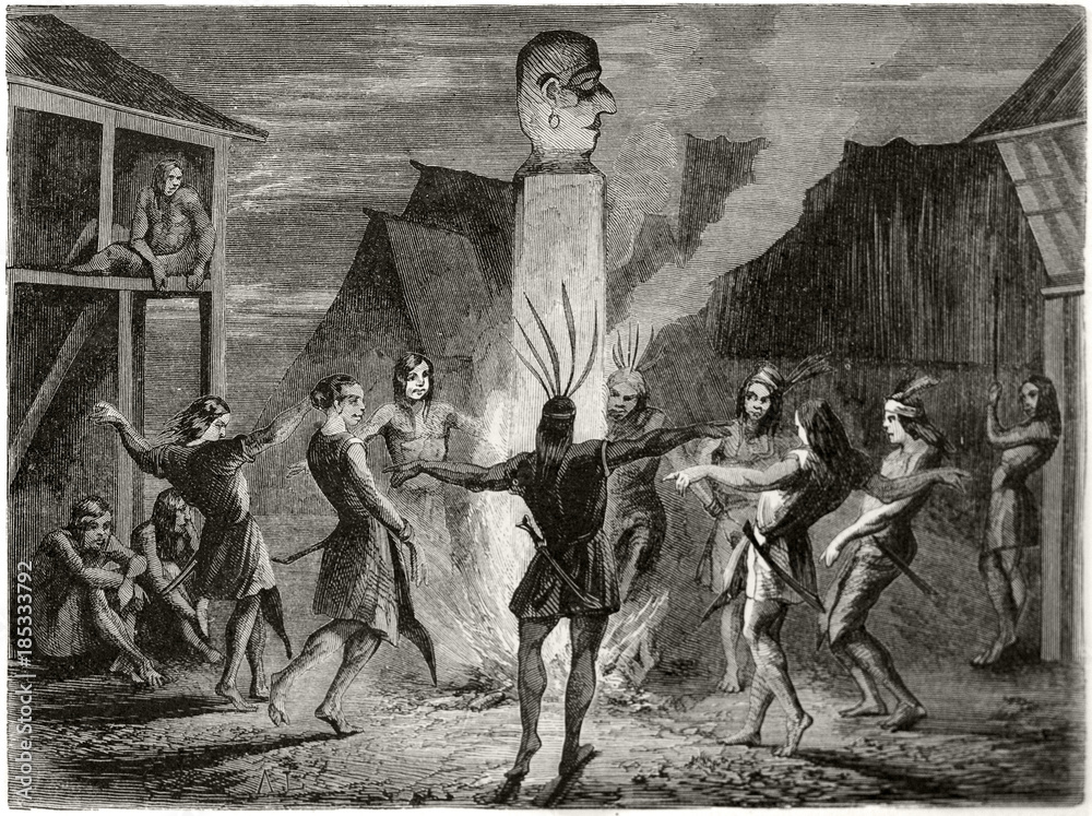 Ancient tribal people dancing in their village around a stone column ...