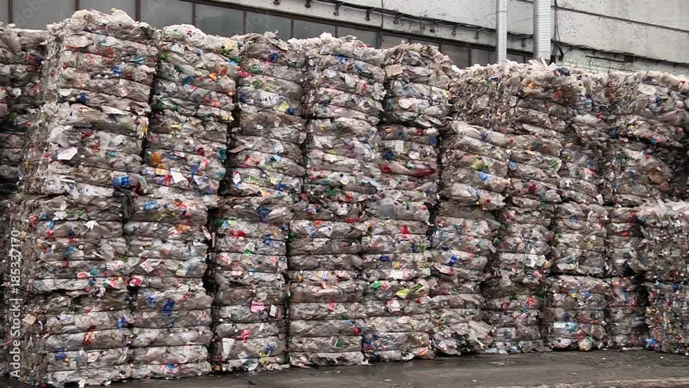Piles of compressed plastic bottles prepared for recycling Stock-Video ...