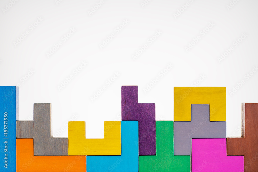 Different colorful shapes wooden blocks on beige background, flat lay ...