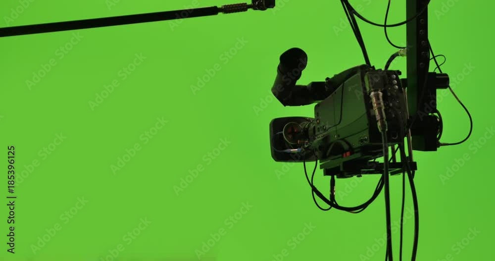 Virtual production studio camera against green screen chroma key ...