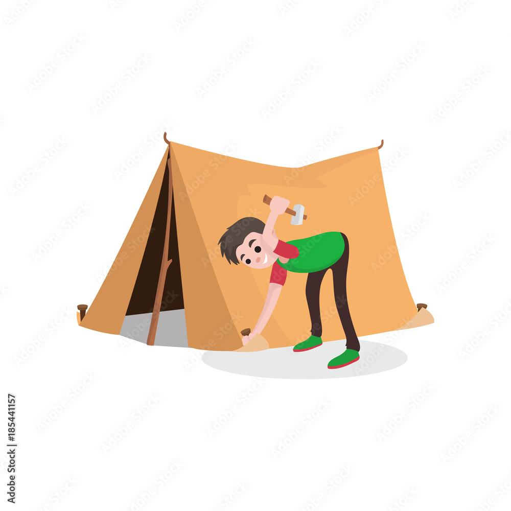 Young smiling teenager boy setting up tourist tent. Summer travel ...