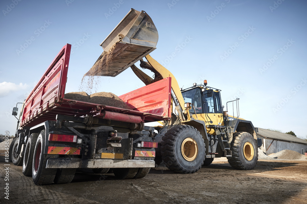 Excavator moving sand Stock Photo | Adobe Stock