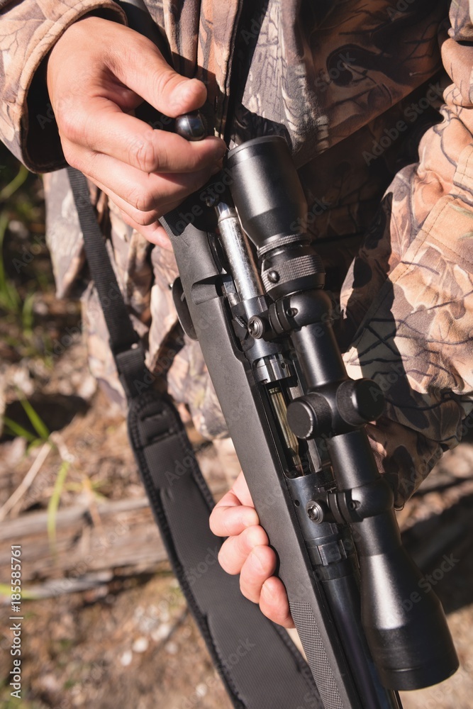 Hunter ready to shoot with sniper rifle Stock Photo | Adobe Stock