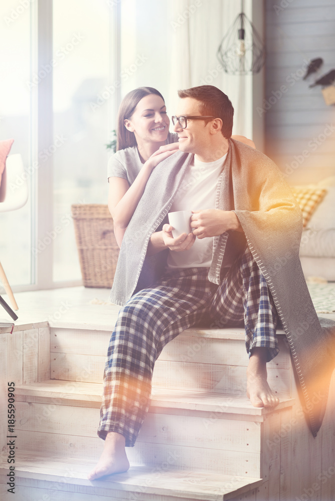 Weekend together. Two charming young people in love sitting by the ...