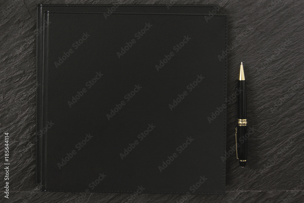 Blank Dark Notebook Cover black rock table with clipping path on ...