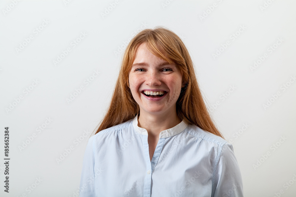 Closeup headshot of young beautiful european lady with red hair ...