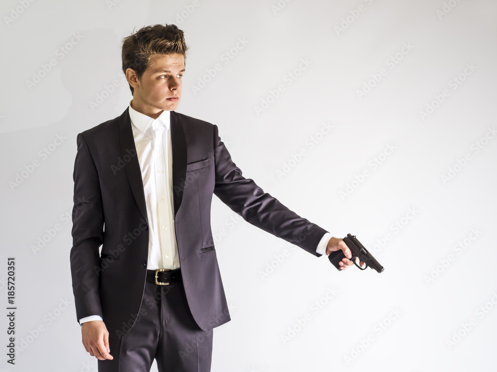 One caucasian spy criminal policeman detective man holding gun portrait ...