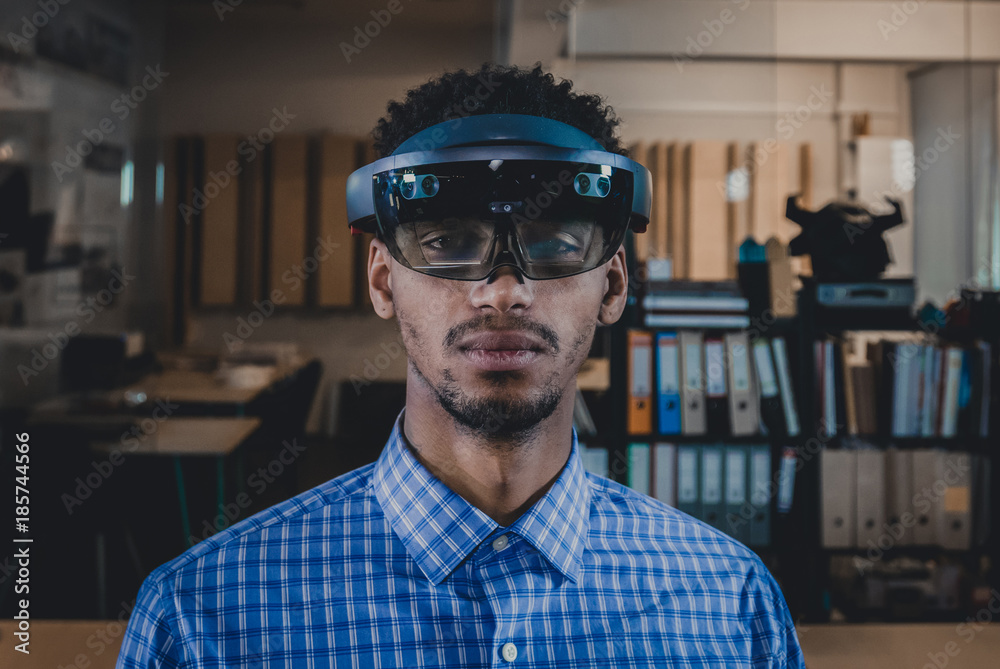 Portrait of young African American black male professional using ...