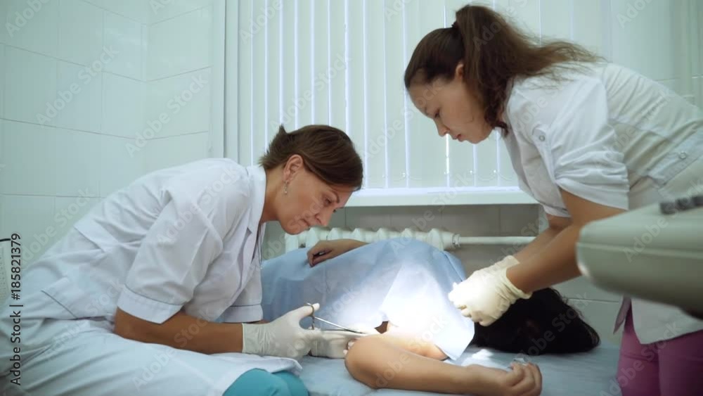 The doctor uses a clamp to pull out the contraceptive subcutaneous ...