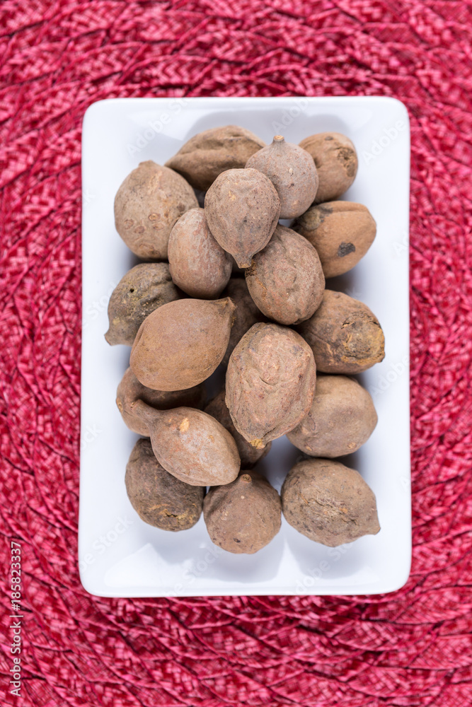 Pile of terminalia bellerica on a cloth background Stock Photo | Adobe ...