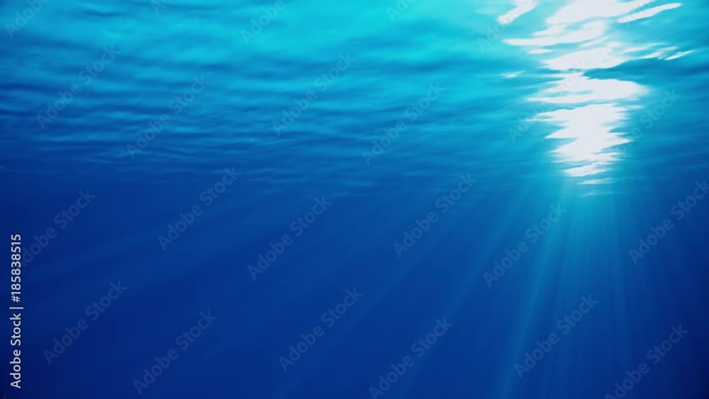 underwater sea scene view with natural light rays, shining through the ...